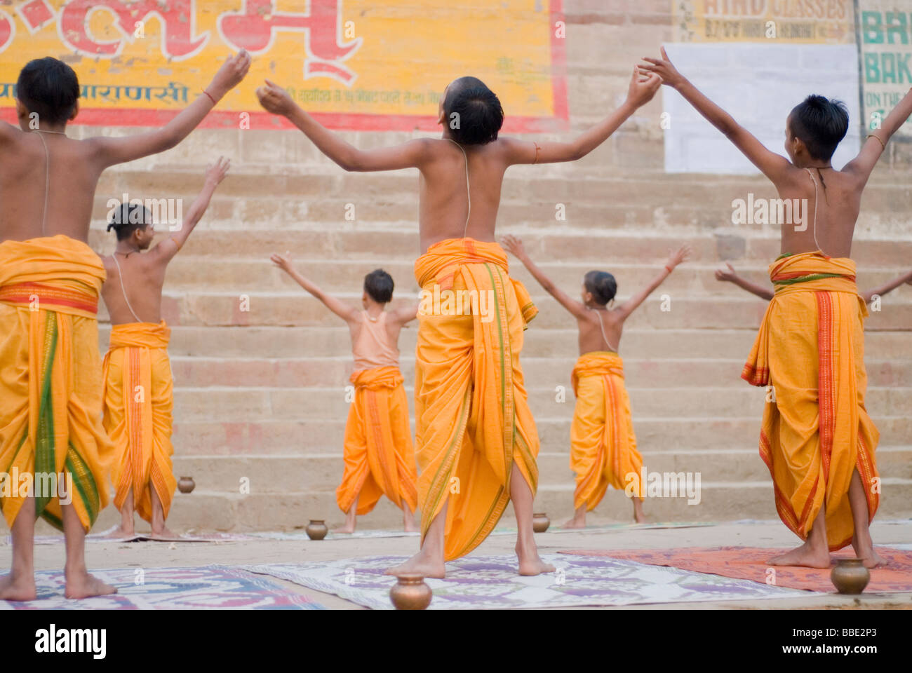 Young yogis doing asana and puja in Varanasi, India Stock Photo - Alamy