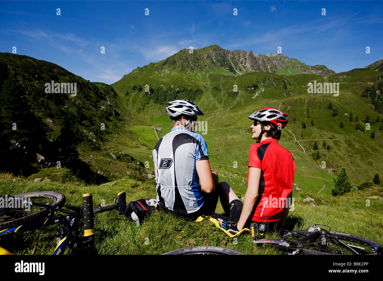 Mountain bikers having a break, Mt Galtenberg in the back, Kitzbuehl ...