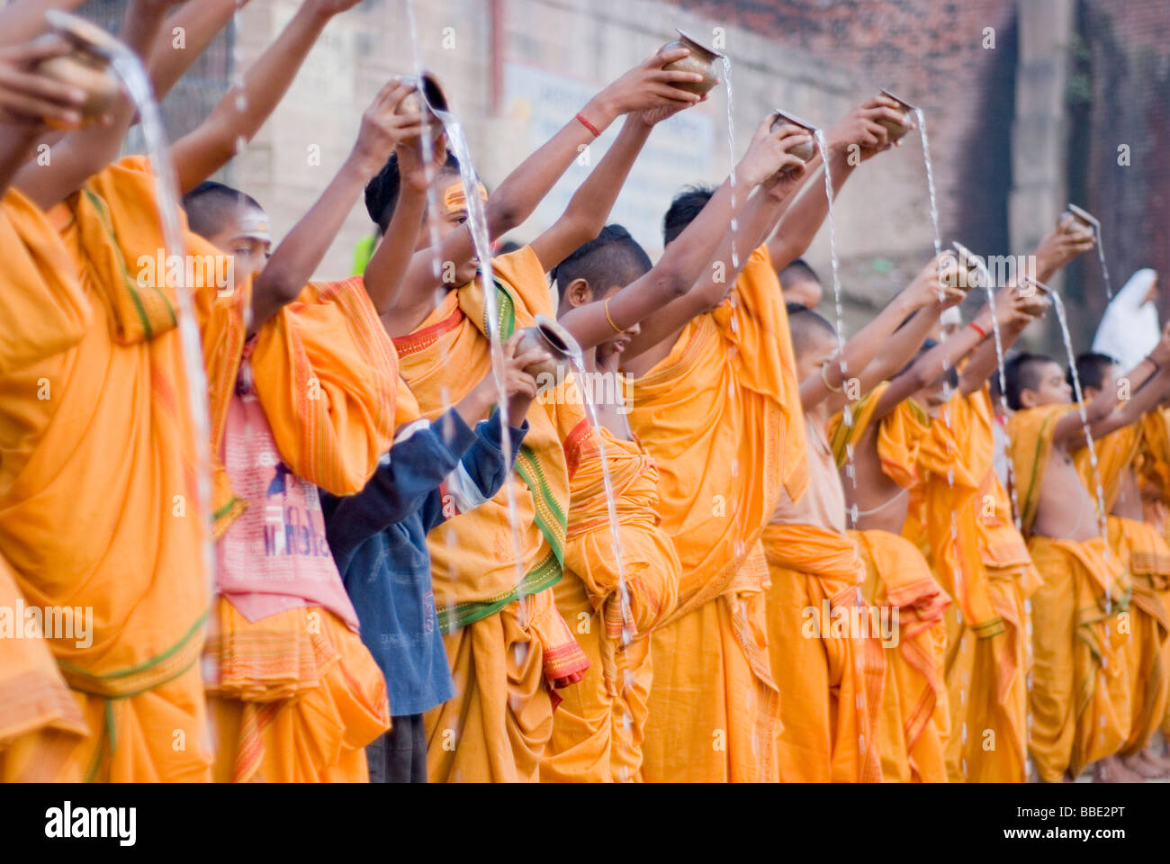 Young yogis doing asana and puja in Varanasi, India Stock Photo - Alamy