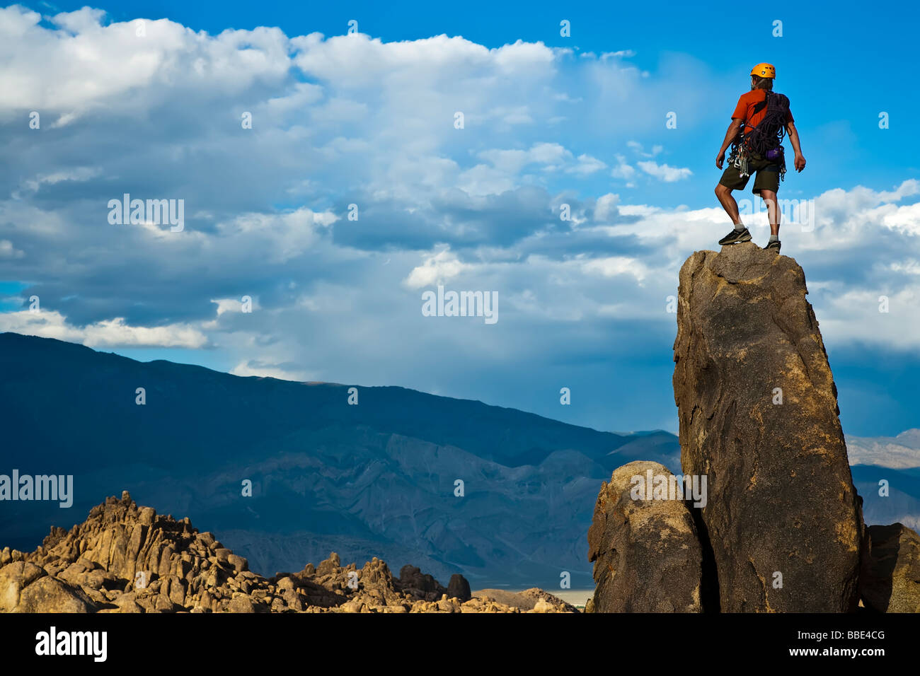 Climber on the summit Stock Photo - Alamy