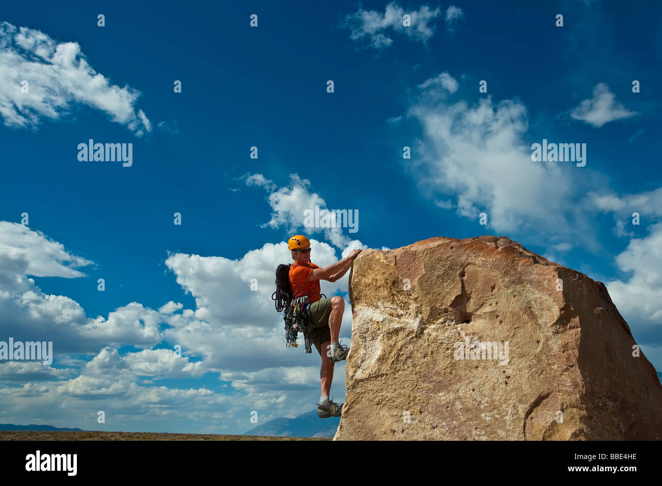 Climber on the summit Stock Photo - Alamy