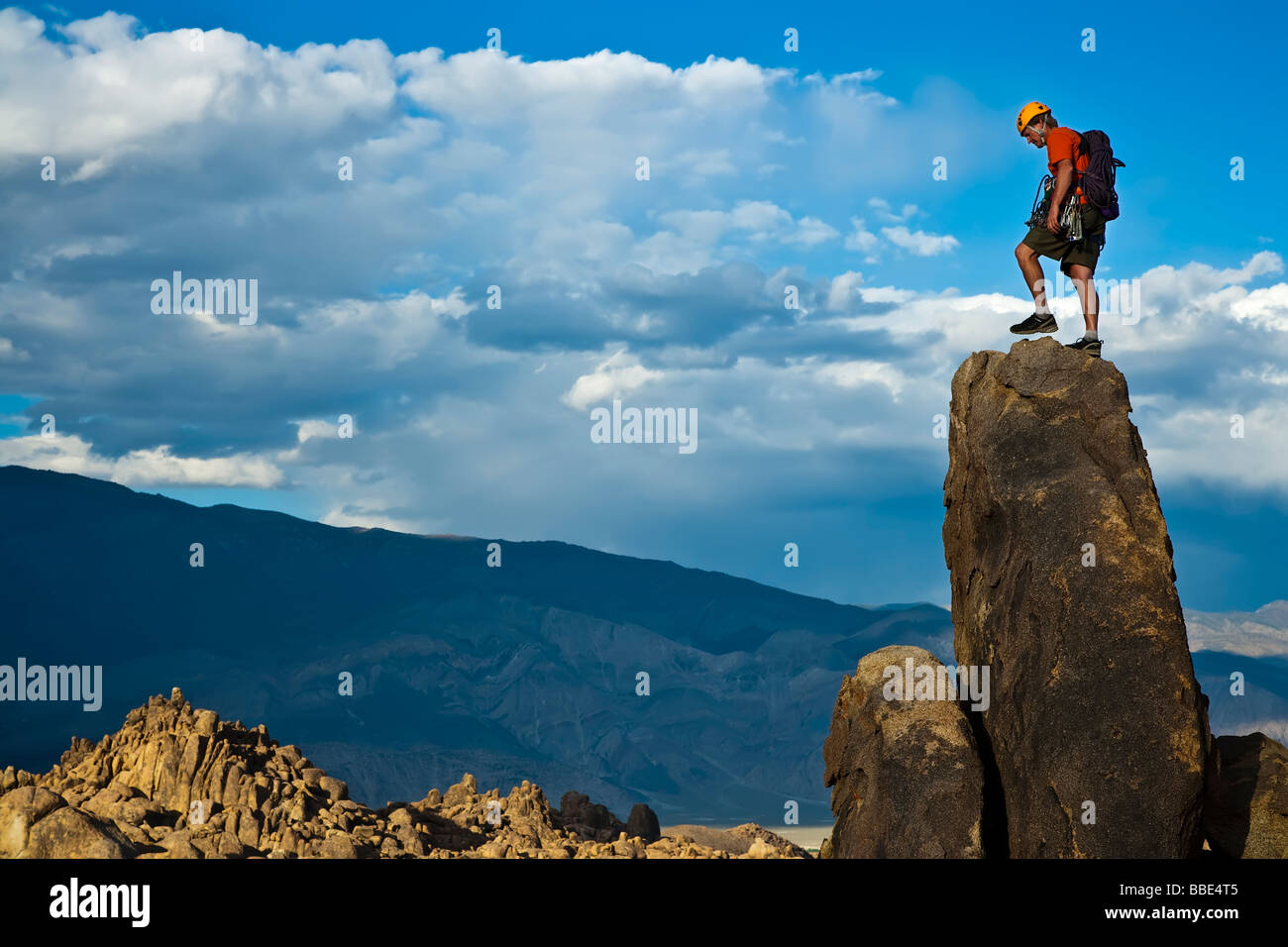 Climber on the summit Stock Photo - Alamy