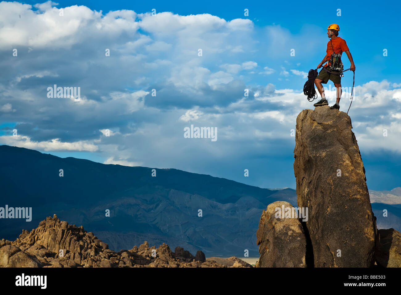 Climber on the summit Stock Photo - Alamy