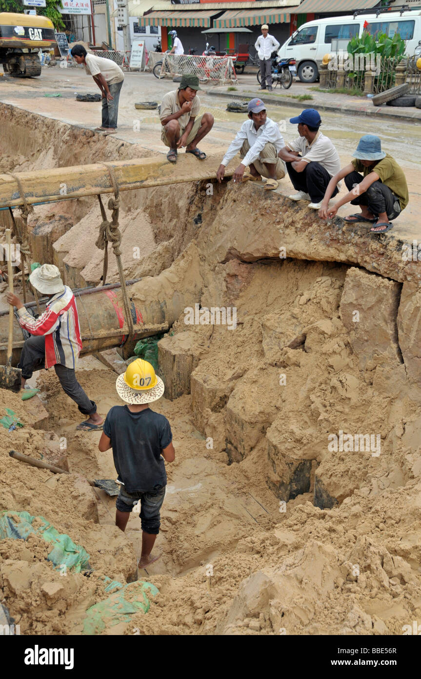 Construction workers on a road building site in Siem Reap, Cambodia ...