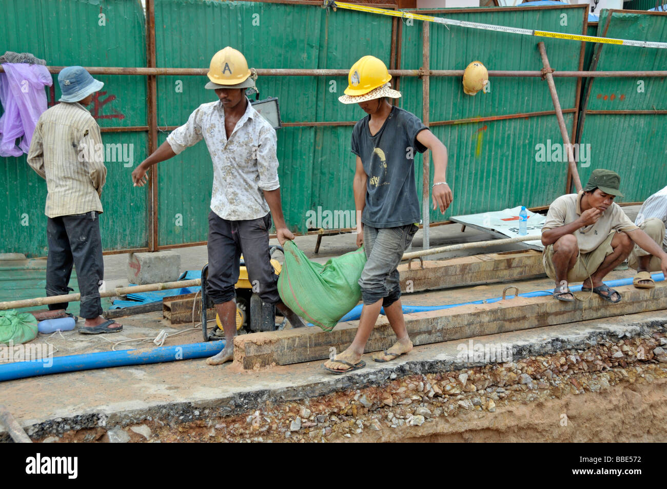 Construction workers on a road building site in Siem Reap, Cambodia ...