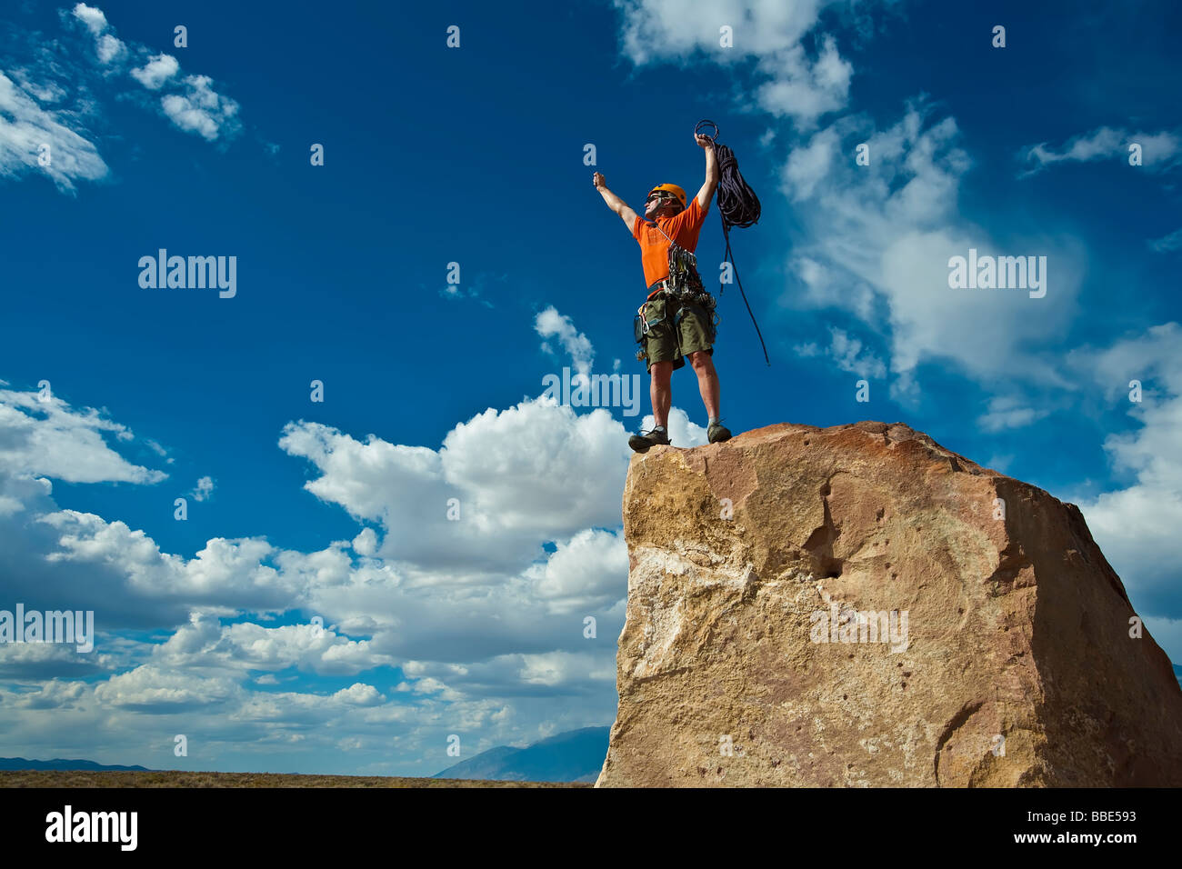 Climber on the summit Stock Photo - Alamy