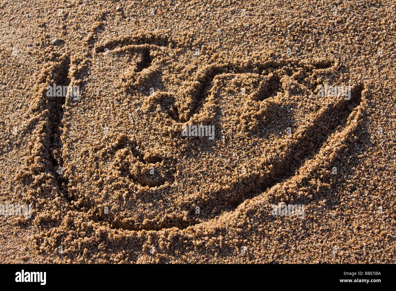 Happy face drawing in sand hi-res stock photography and images - Alamy