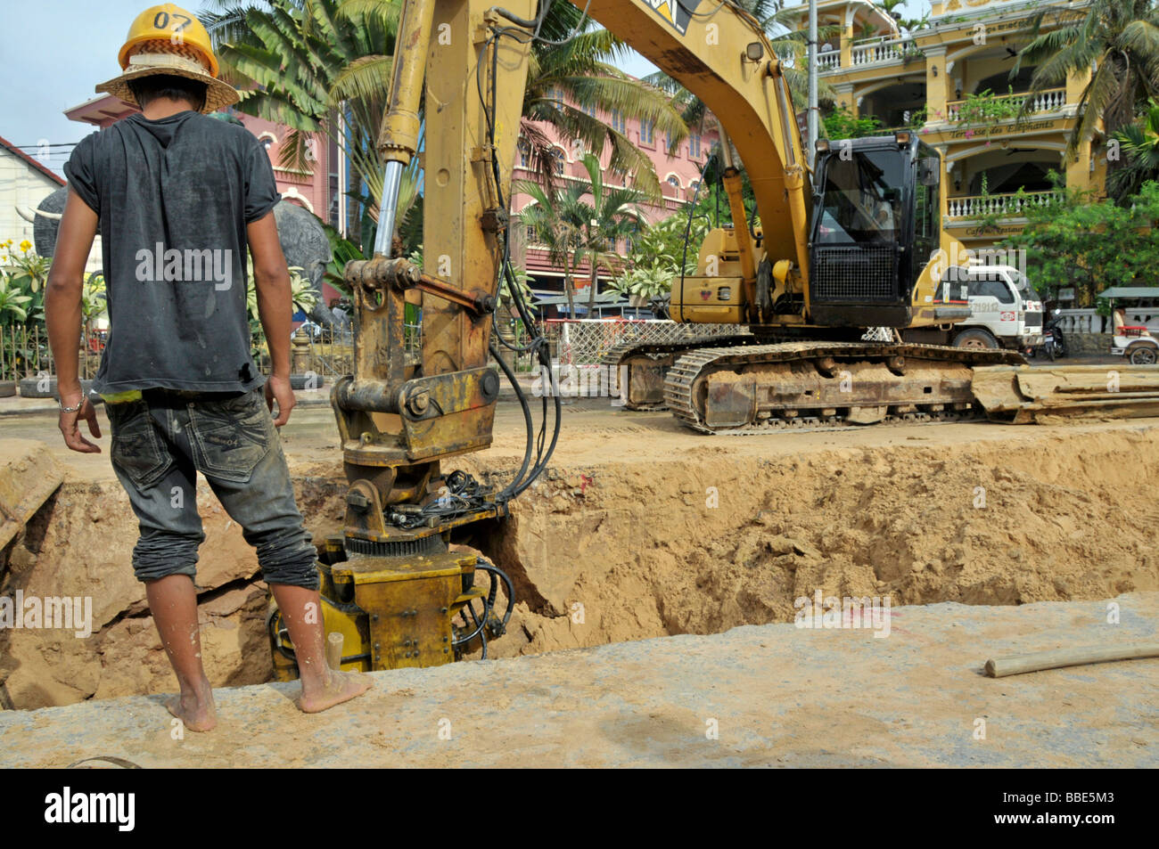 Removal of sheet pile walls, construction workers on a road building ...
