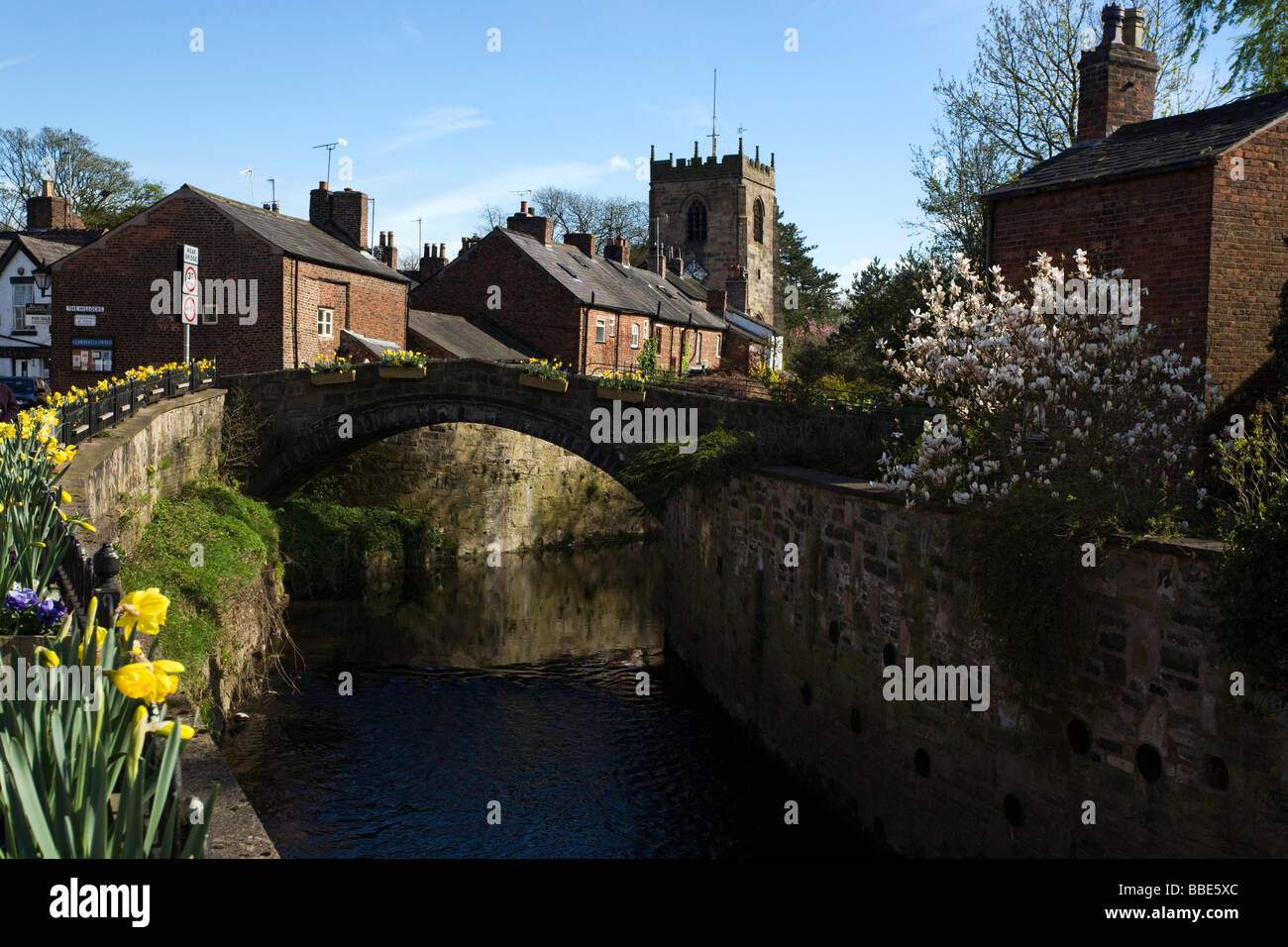 Packhorse bridge over the River Yarrow at Croston in Lancashire with St ...