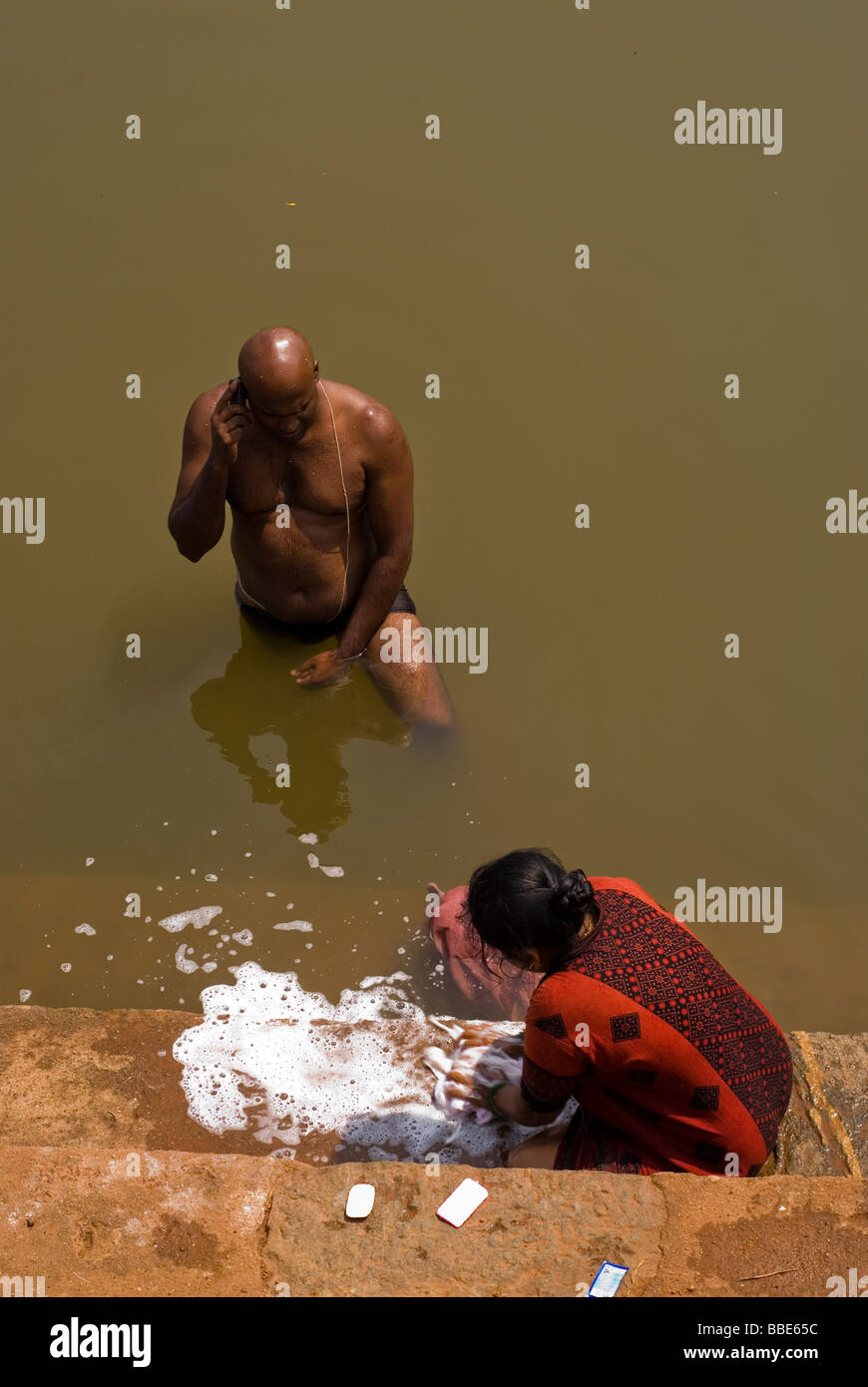 Indian man washing clothes in hi-res stock photography and images - Alamy