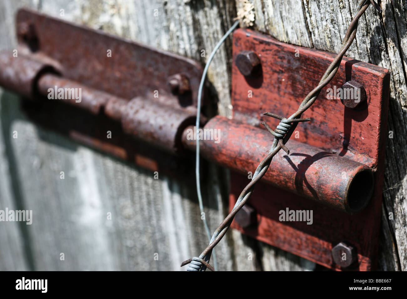 Rusty door bolt in old door latch Stock Photo - Alamy