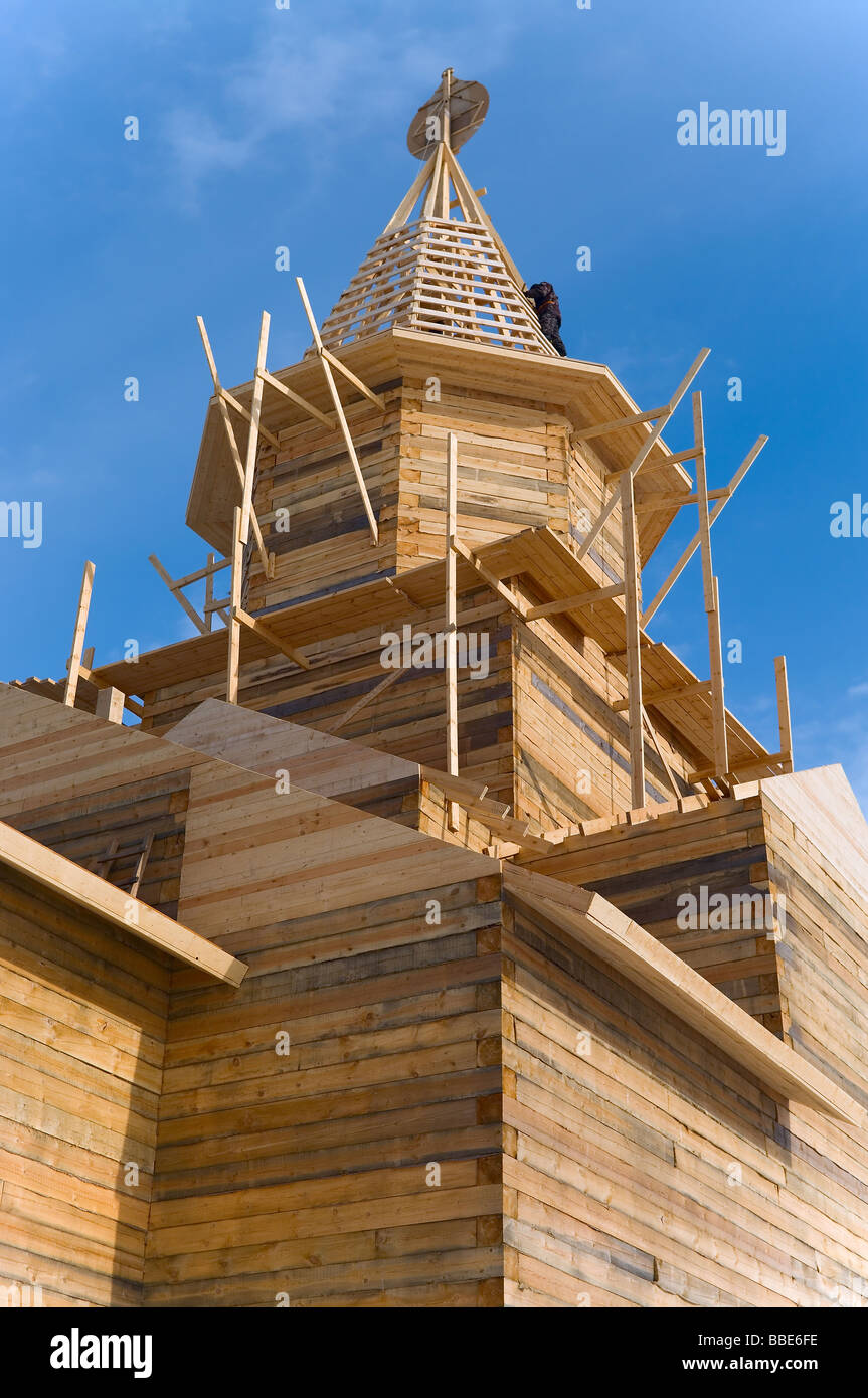Wooden church under construction on the blue sky background. Segezha ...