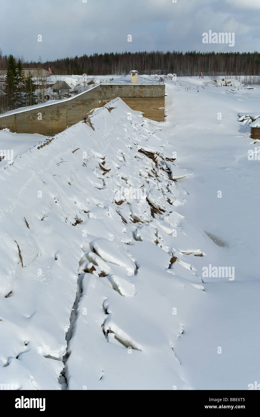 Water overflow on the man-made reservoir storage in winter season. It ...