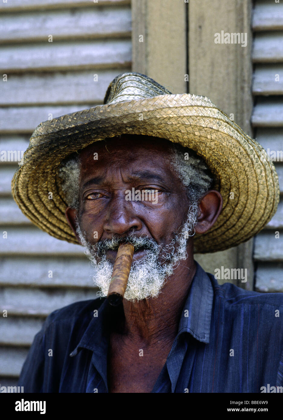 An elderly Cuban man enjoying a cigar Stock Photo - Alamy