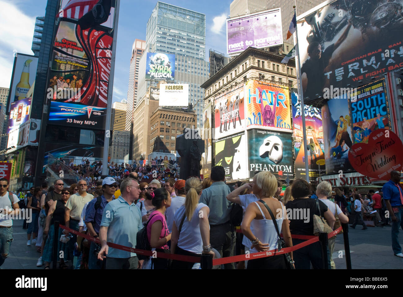Theatregoers on line at the TKTS ticket booth in Times Square in New ...