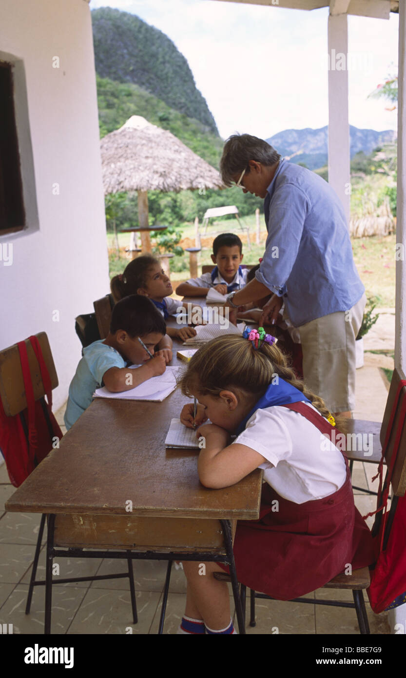 Young school children with their teacher at a rural village school in ...
