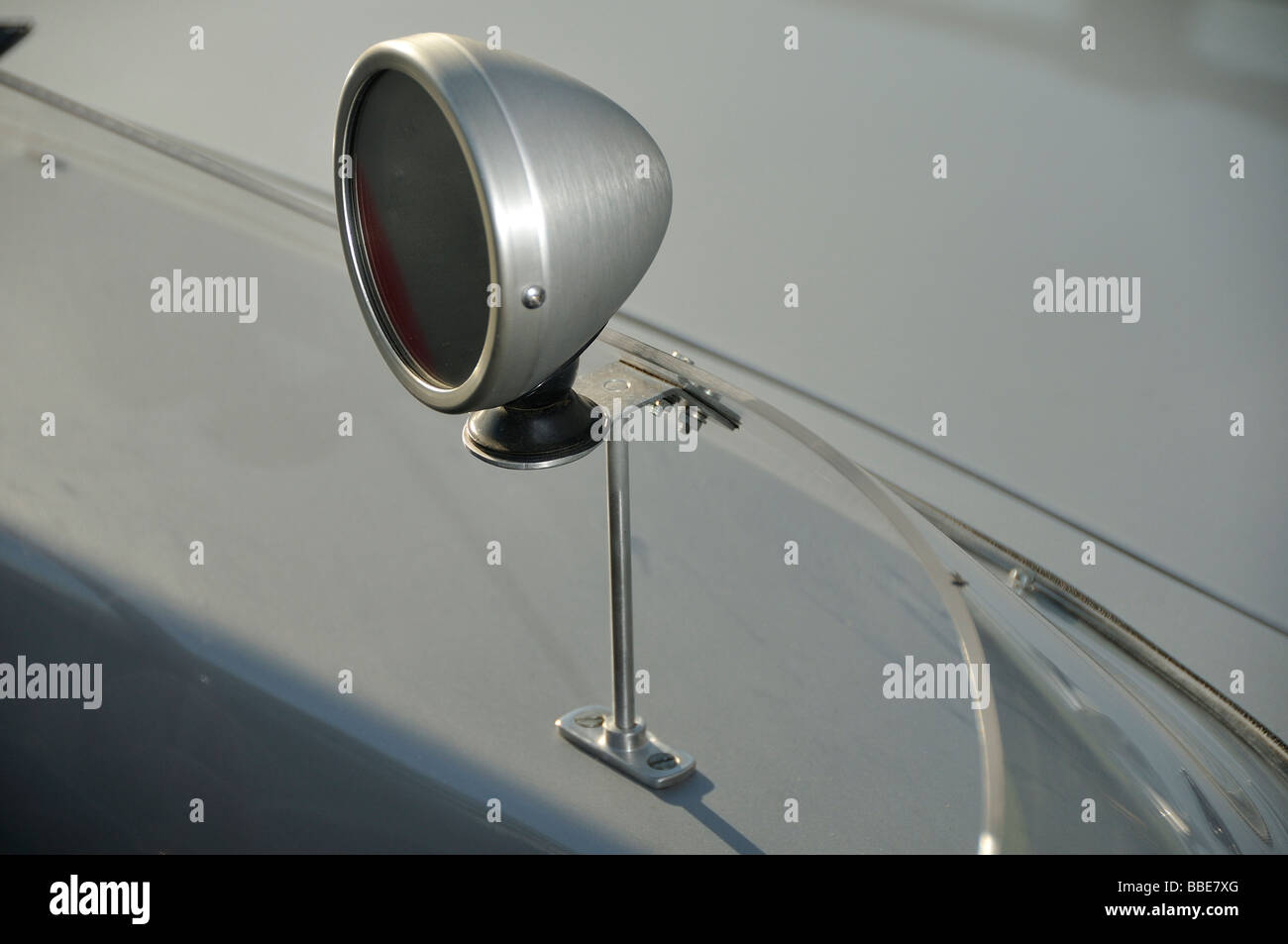 Race mirror on the aeroscreen of an historic Porsche race car, the 718 ...
