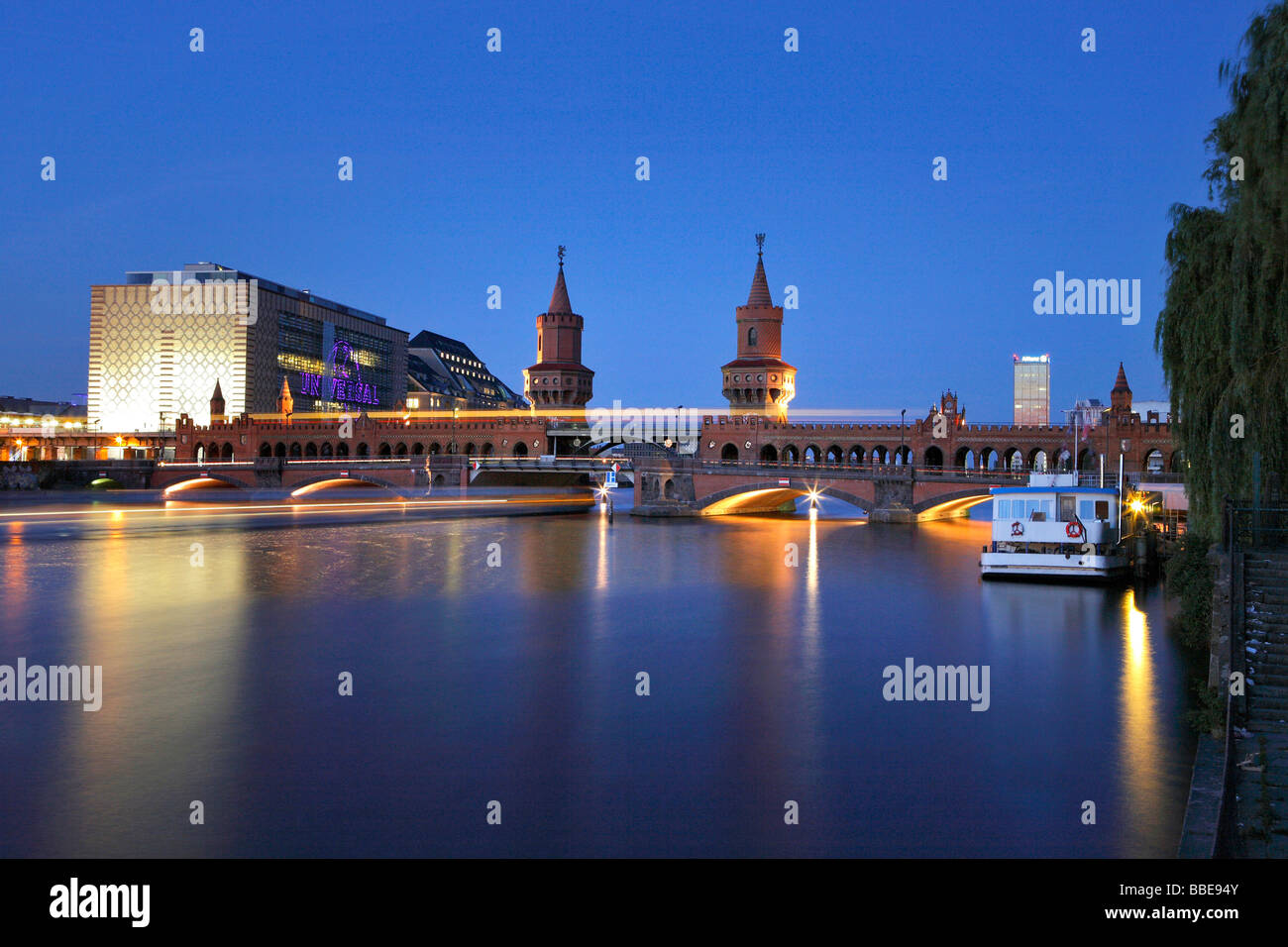 Oberbaumbruecke bridge across the Spree river in the evening in Berlin ...