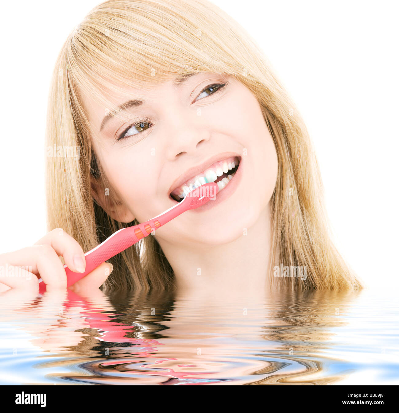 picture of happy girl with toothbrush in water Stock Photo - Alamy