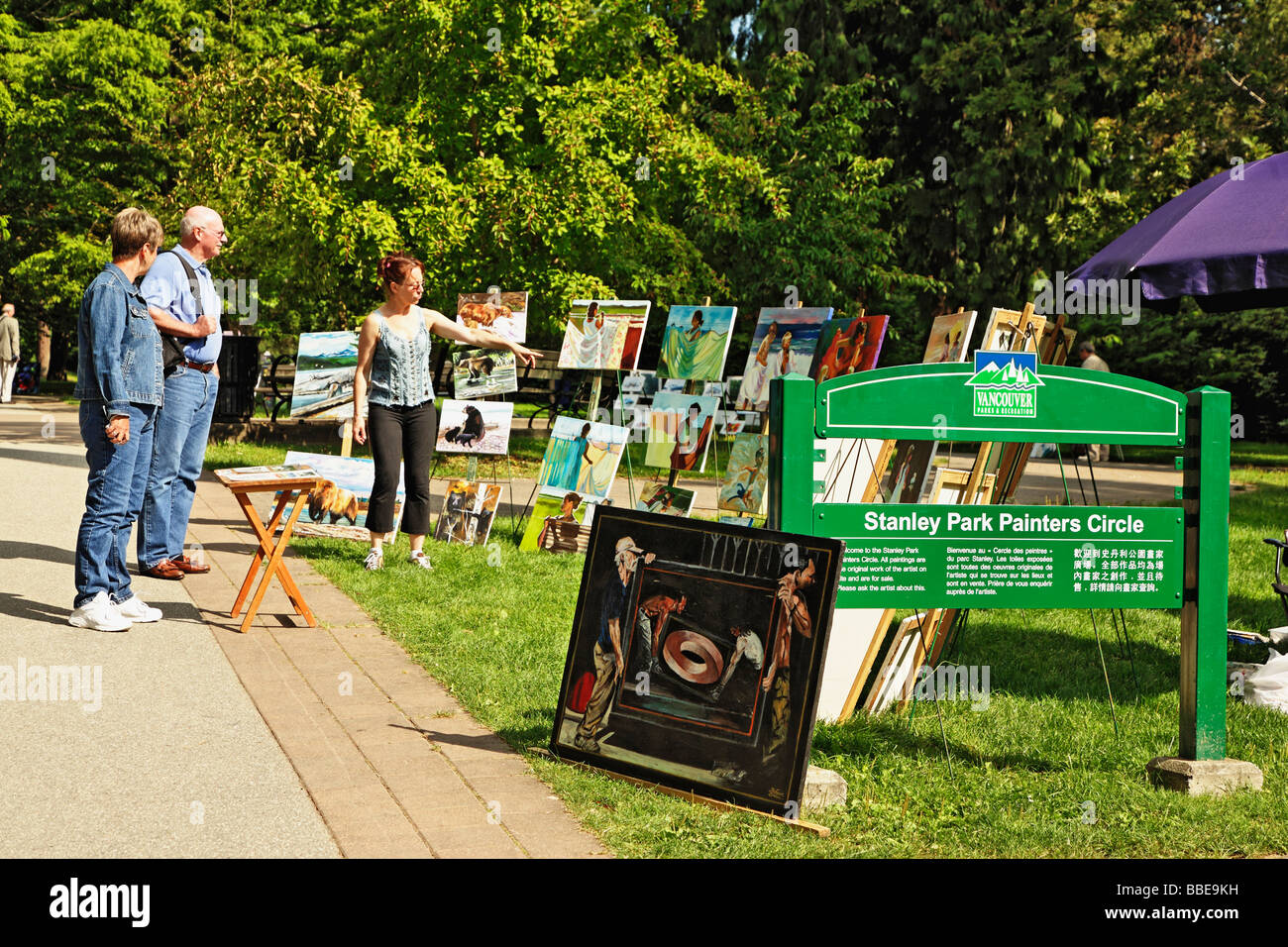 Artist displaying his paintings in Stanley Park Vancouver British ...