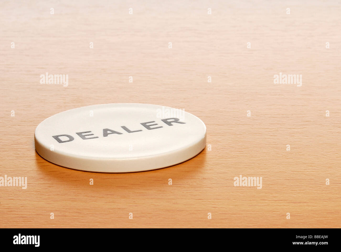 Dealer chip on desk Stock Photo - Alamy