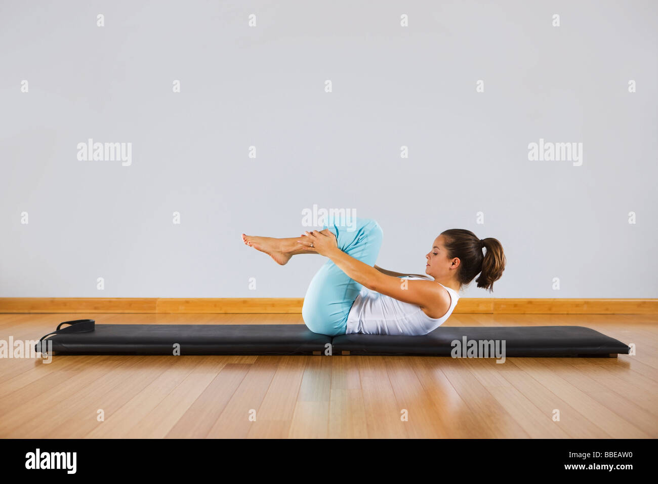 Woman Doing Pilates Core Exercises Stock Photo - Alamy