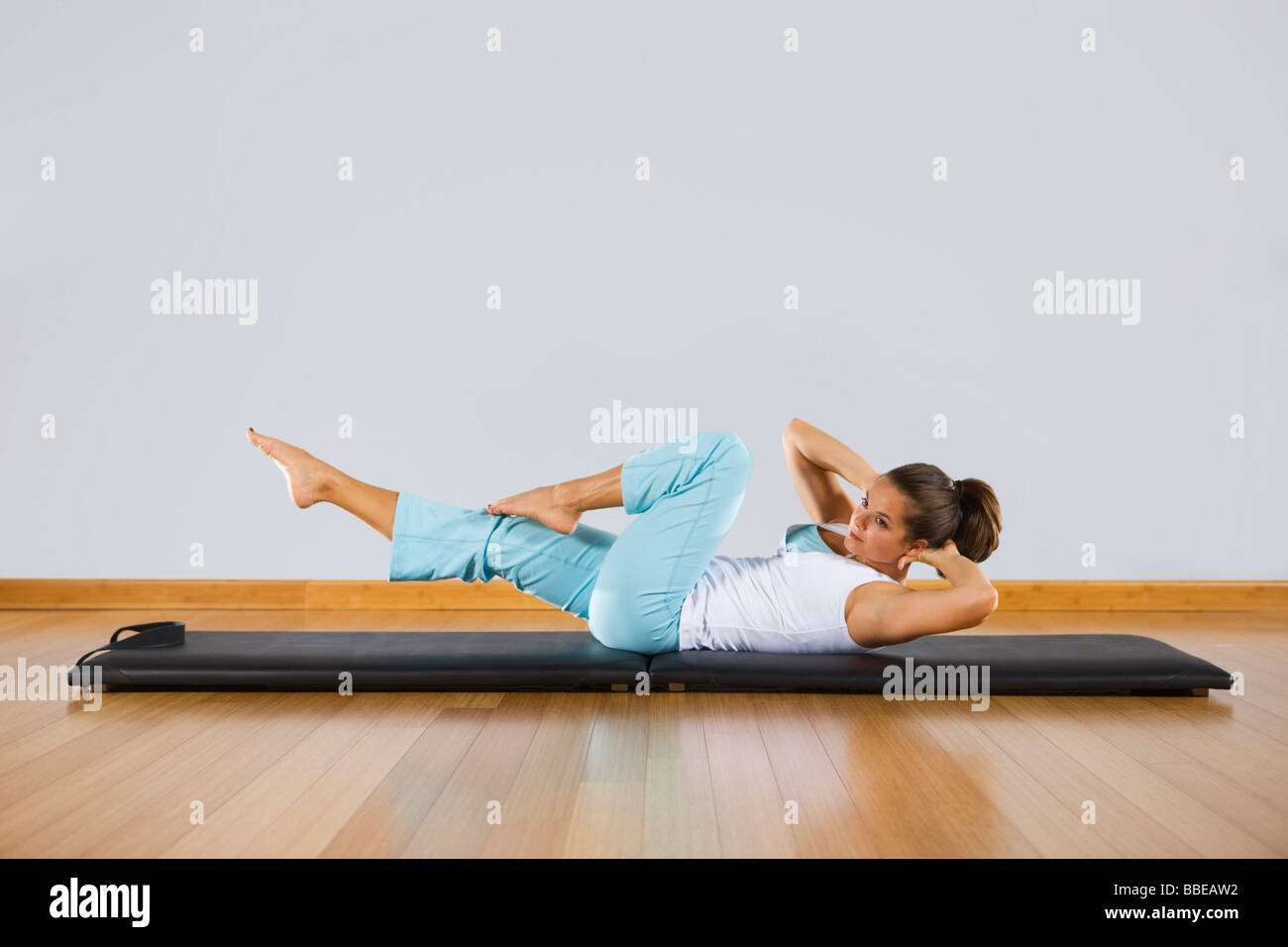 Woman Doing Pilates Core Exercises Stock Photo - Alamy