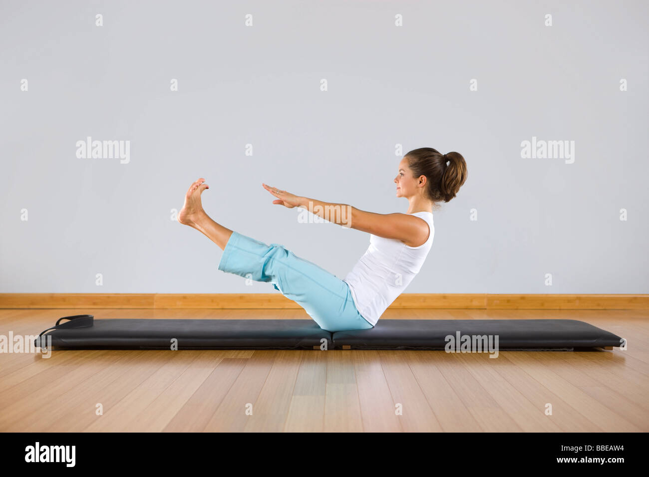 Woman Doing Pilates Core Exercises Stock Photo - Alamy
