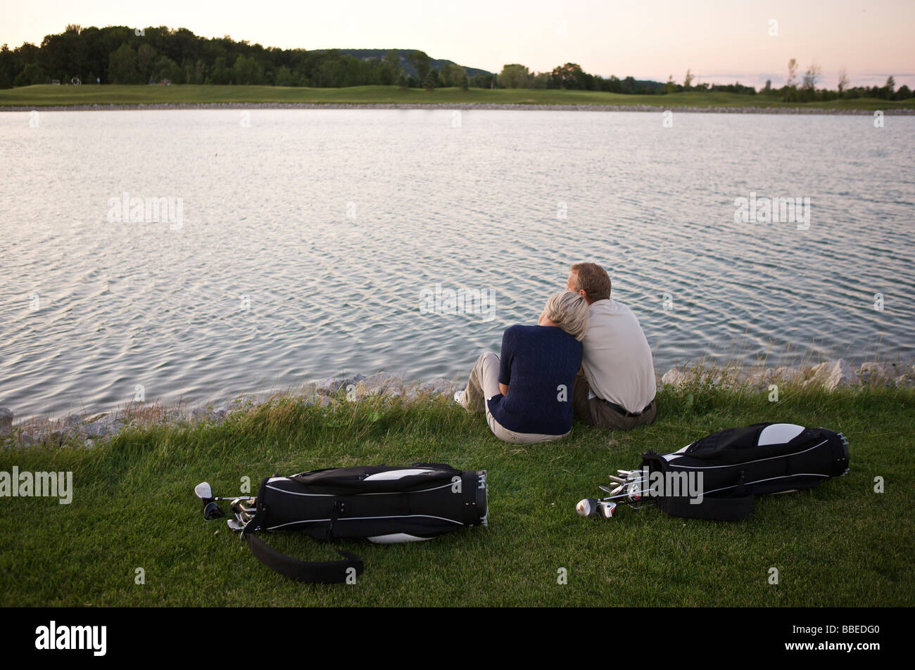 Couple Sitting by Pond on Golf Course, Burlington, Ontario, Canada ...
