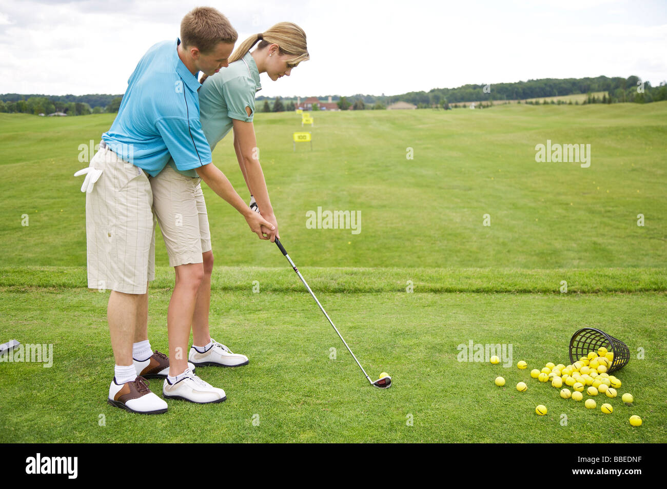 Side view woman playing golf hi-res stock photography and images - Alamy