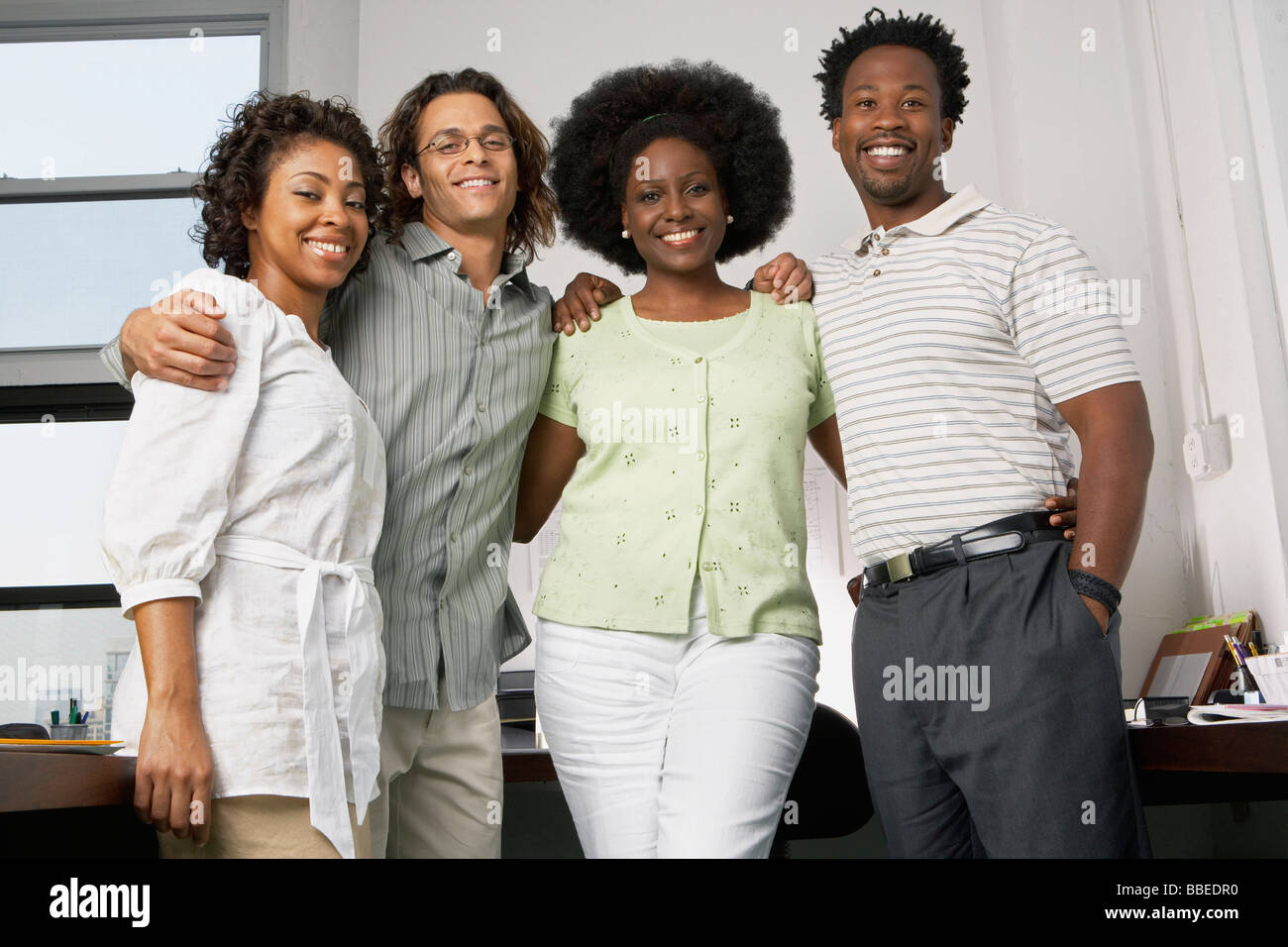 Team office collaboration embracing hi-res stock photography and images ...