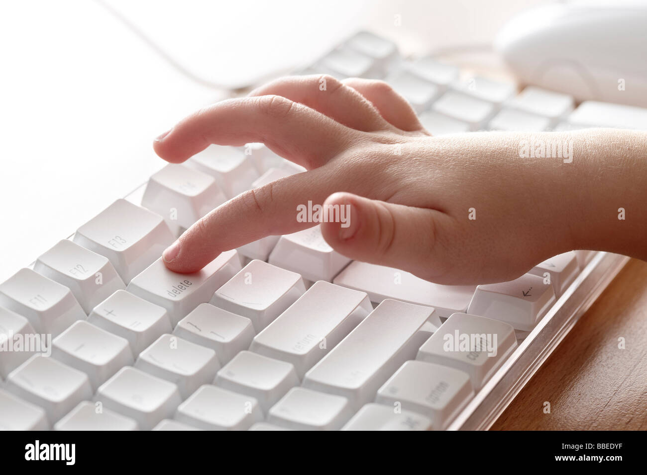 Child Pressing Delete Key on Computer Stock Photo - Alamy