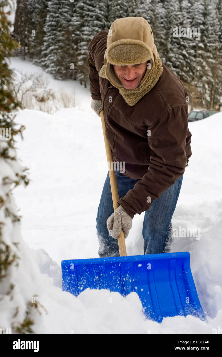 Man Shovelling Snow, Hof bei Salzburg, Austria Stock Photo - Alamy