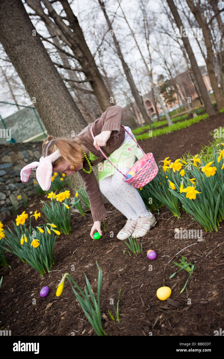 Little Girl Looking for Easter Eggs Stock Photo - Alamy
