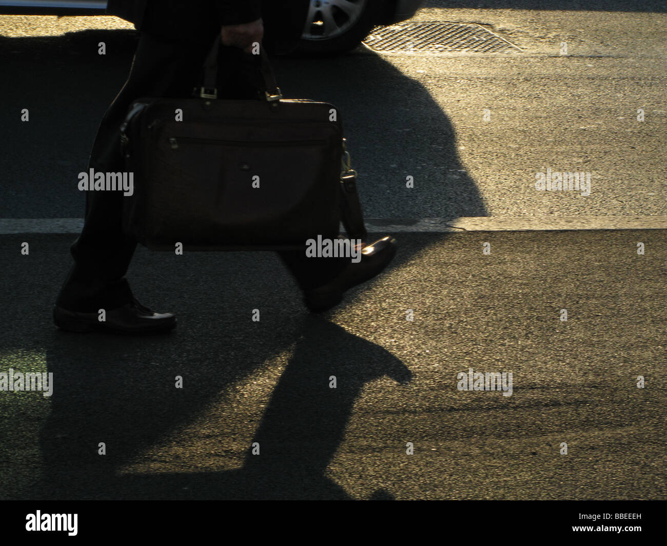 one person walking in street in city town Stock Photo - Alamy