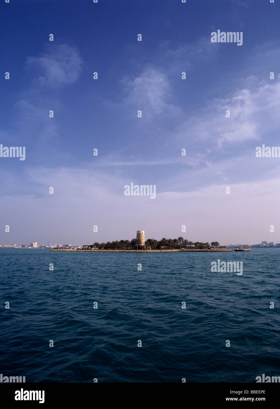 QATAR Doha Palm Tree Island Resort in Doha Harbour with clouds in blue ...