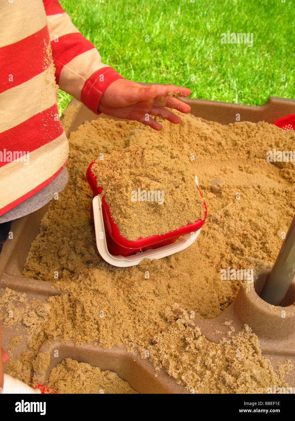 A Boy Plays in A Sandbox Stock Photo - Alamy