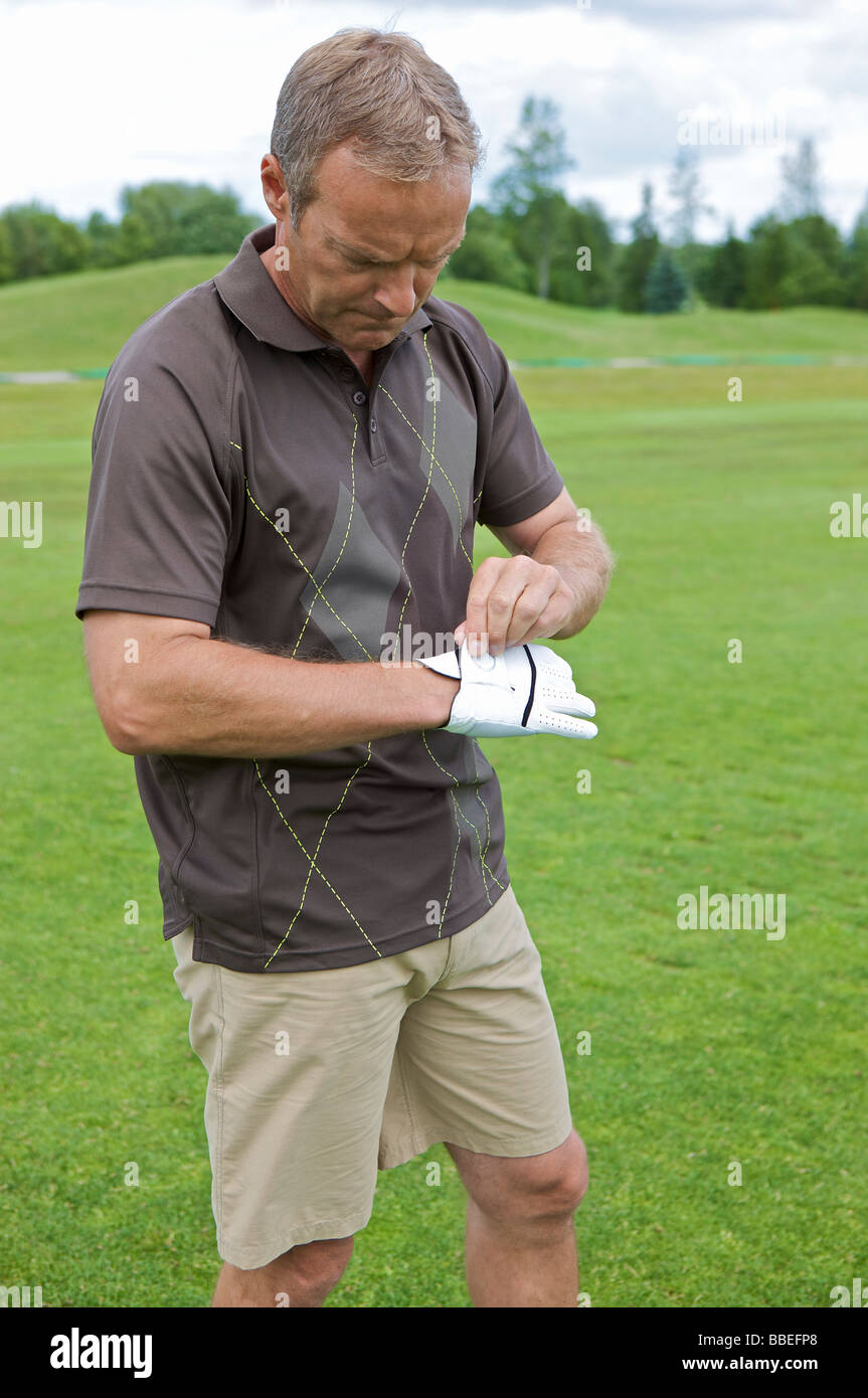 Old man putting on clothes hi-res stock photography and images - Alamy