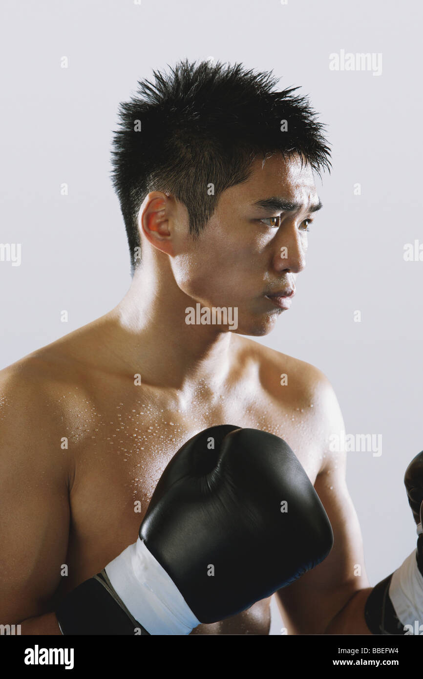 Japanese boxer wearing gloves and sweating Stock Photo - Alamy