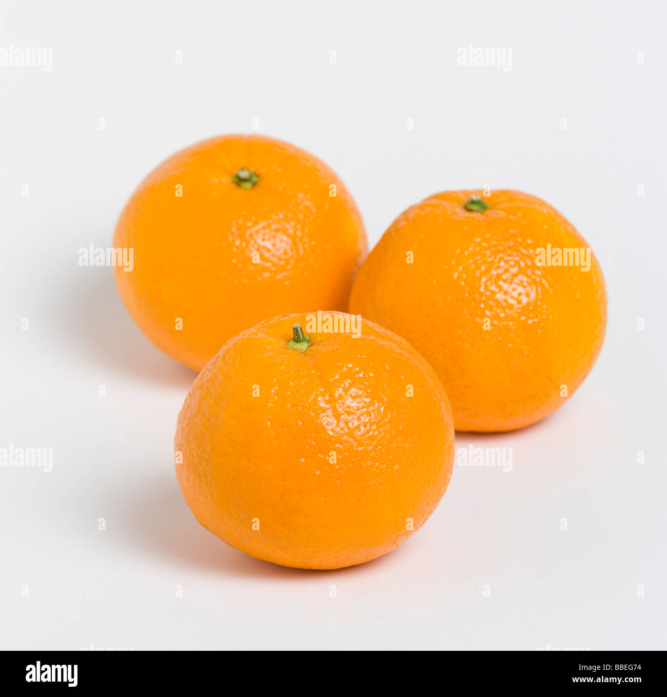 FOOD Fruit Citrus Group of three oranges on a white background Stock ...