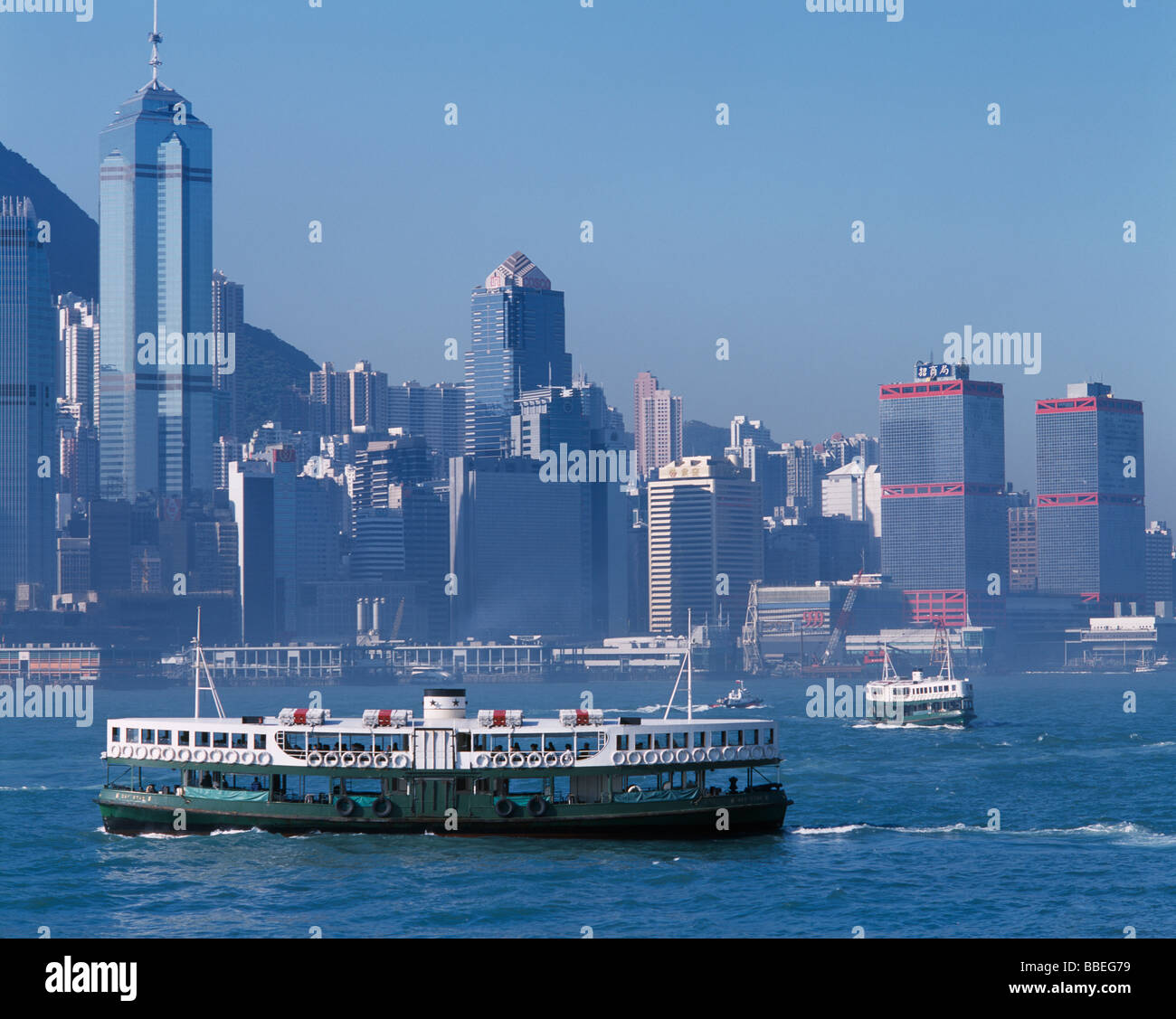 CHINA Hong Kong Victoria Harbour Star Ferries crossing Harbor with high ...