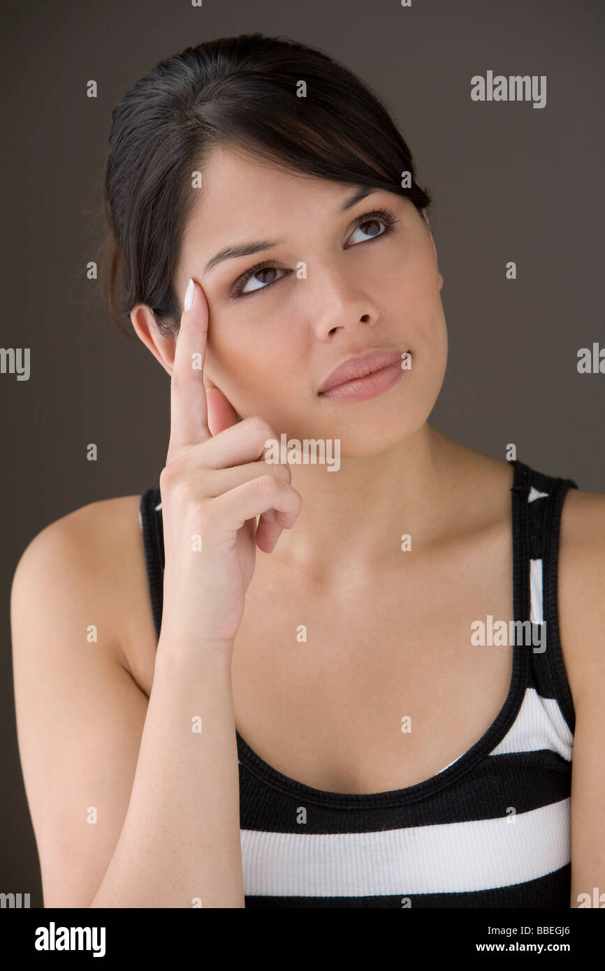 Portrait of Woman Looking Thoughtful Stock Photo - Alamy