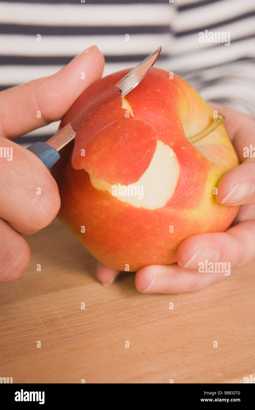 Hands Peeling Apple Stock Photo - Alamy