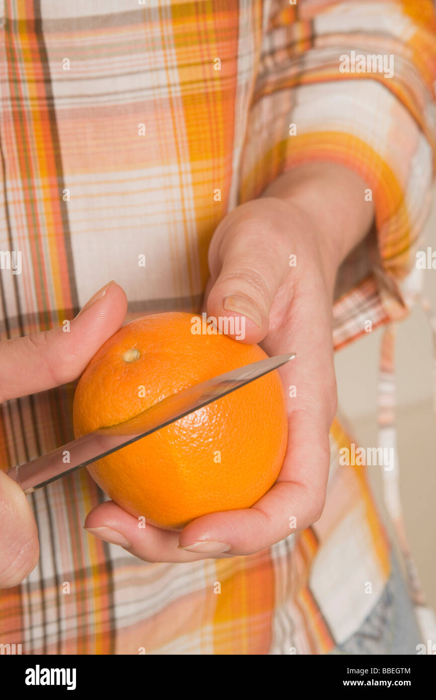 Hands Peeling Orange Stock Photo - Alamy