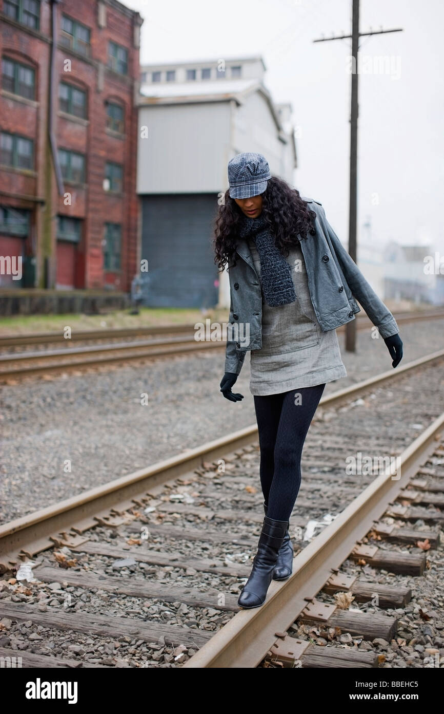 Woman Walking on Railroad Tracks in Urban Industrial Area, Portland ...