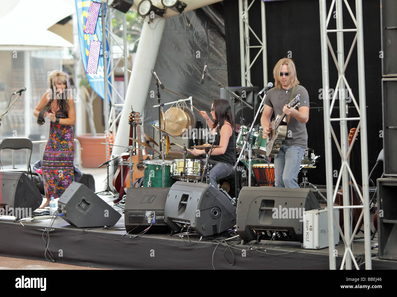 Trio of musicians playing the blues on stage Stock Photo - Alamy