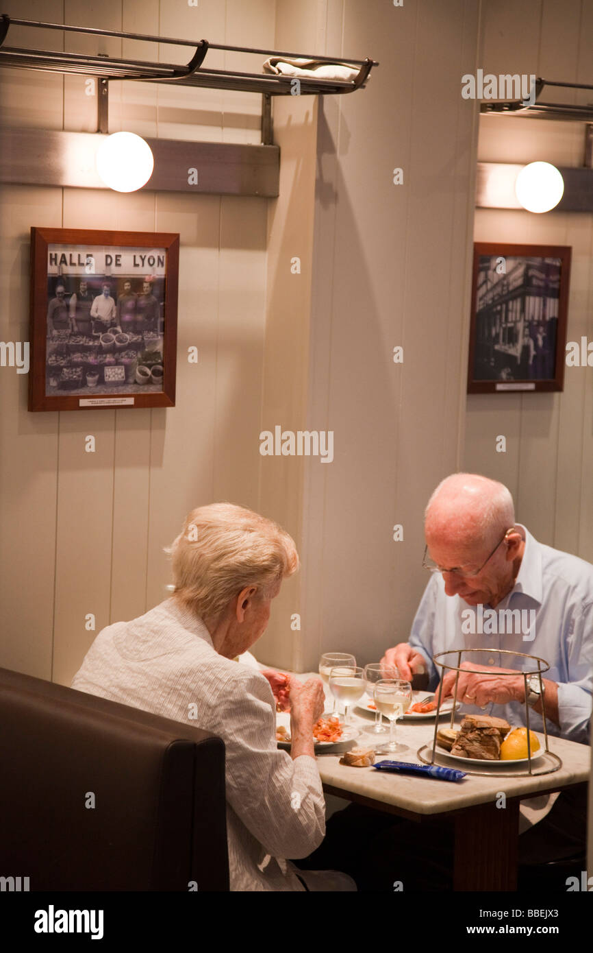 Old retired couple in Merle Sea Food restaurant in Les Halles de Lyon ...