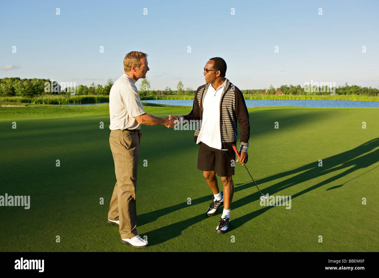 Multiethnic shaking hand golf hi-res stock photography and images - Alamy