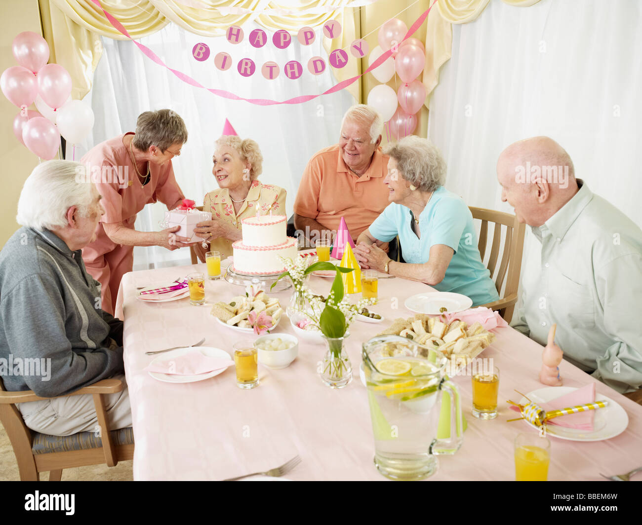 Seniors in a Retirement Home Celebrating a Birthday Stock Photo - Alamy