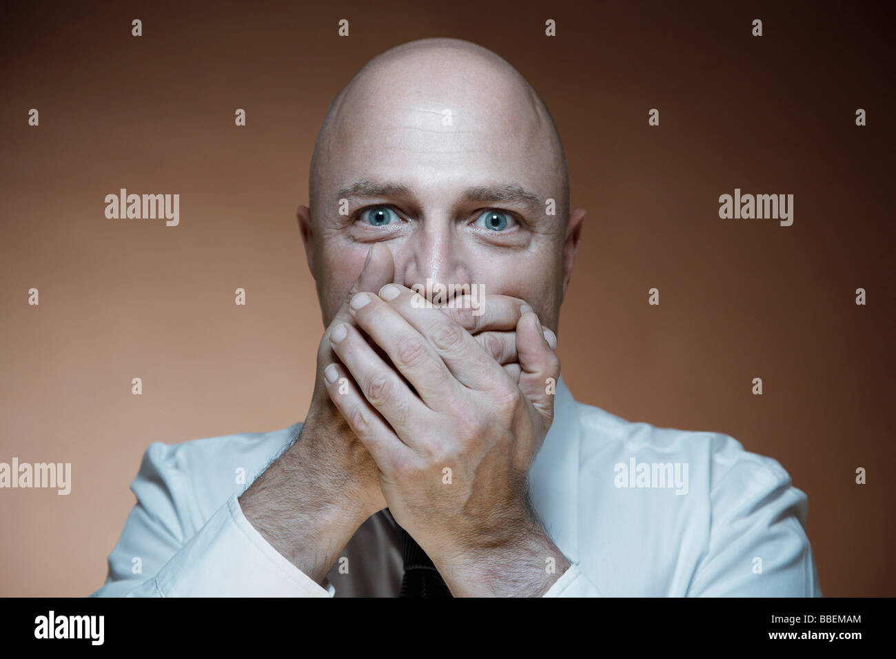 Man With Hand Over Mouth High Resolution Stock Photography and Images ...